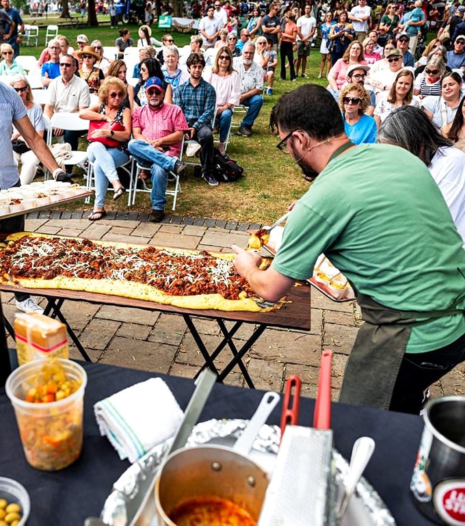 Nothing brings people together like a massive pizza. This community gathering celebrates food as it should be – shared, abundant, and slightly messy.