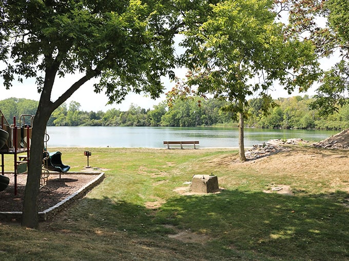 Quiet park benches facing calm waters—nature's version of therapy that doesn't require filling out insurance paperwork.