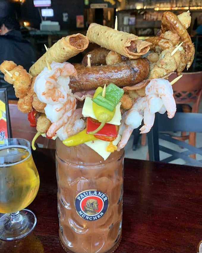 Not just a Bloody Mary—it's a full meal masquerading as a cocktail. Those shrimp are basically skydivers leaping into tomato paradise.