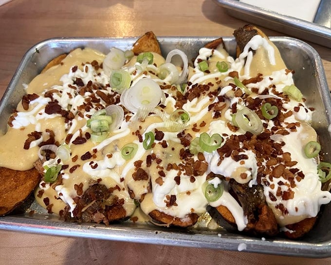 Loaded potato skins that make you question why you've wasted years eating lesser versions. The green onions aren't garnish—they're punctuation.