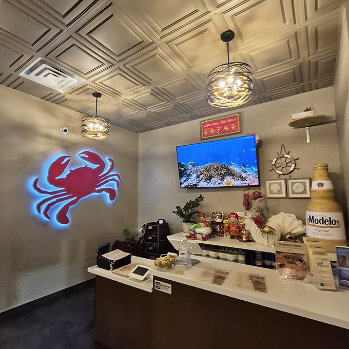 The entrance area's glowing crab sign serves as a beacon of seafood excellence, while nautical touches remind you of the ocean's bounty awaiting inside.