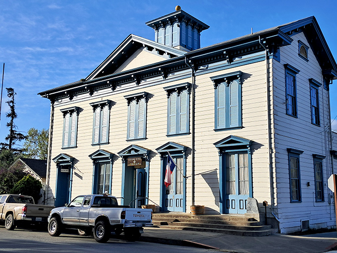 The Masonic Lodge stands as a perfect example of 19th-century architectural confidence. Blue trim never looked so historically significant.