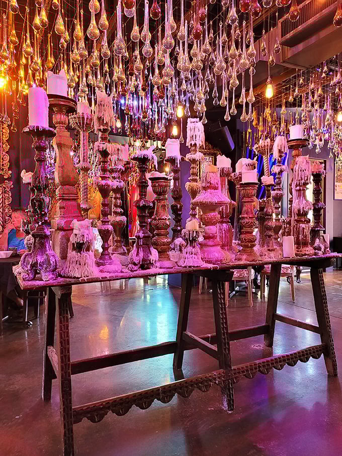 Melted candle décor creates intimate ambiance that whispers "slow down and savor every single delicious moment here."