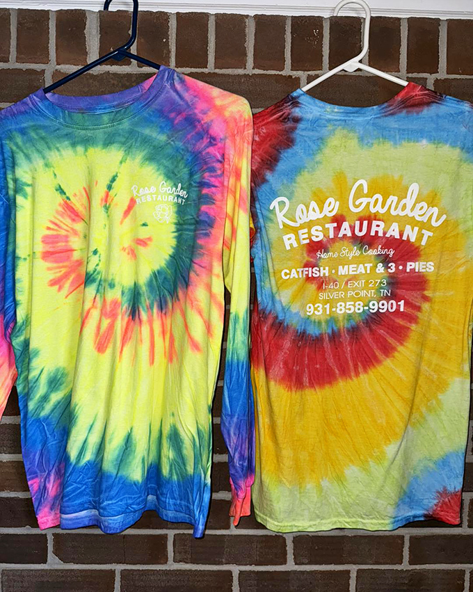 Tie-dye t-shirts so vibrant they could guide lost travelers to this culinary oasis from miles away—the perfect souvenir for pie enthusiasts.