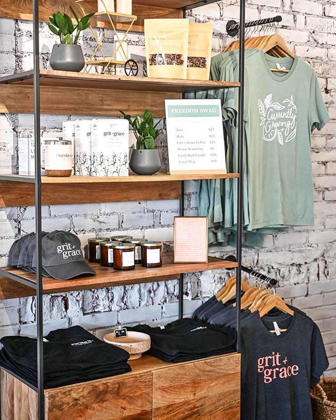 The merch corner says "take a piece of this place home with you" without being pushy about it—like a good friend offering leftovers.