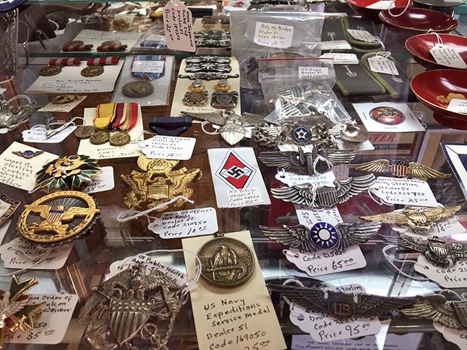 Military medals and insignia that represent courage, sacrifice and history. Each piece represents someone's grandfather's proudest moments, preserved under glass.