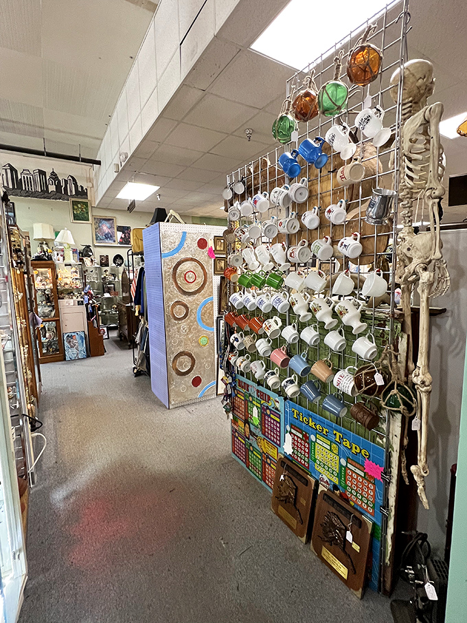 A skeleton watches over a collection of mugs and vintage board games. Even in the afterlife, he's still waiting for his coffee.