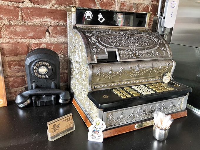 That vintage cash register isn't just decoration—it's a time machine. A beautiful relic from when transactions were tactile and receipts were poetry.