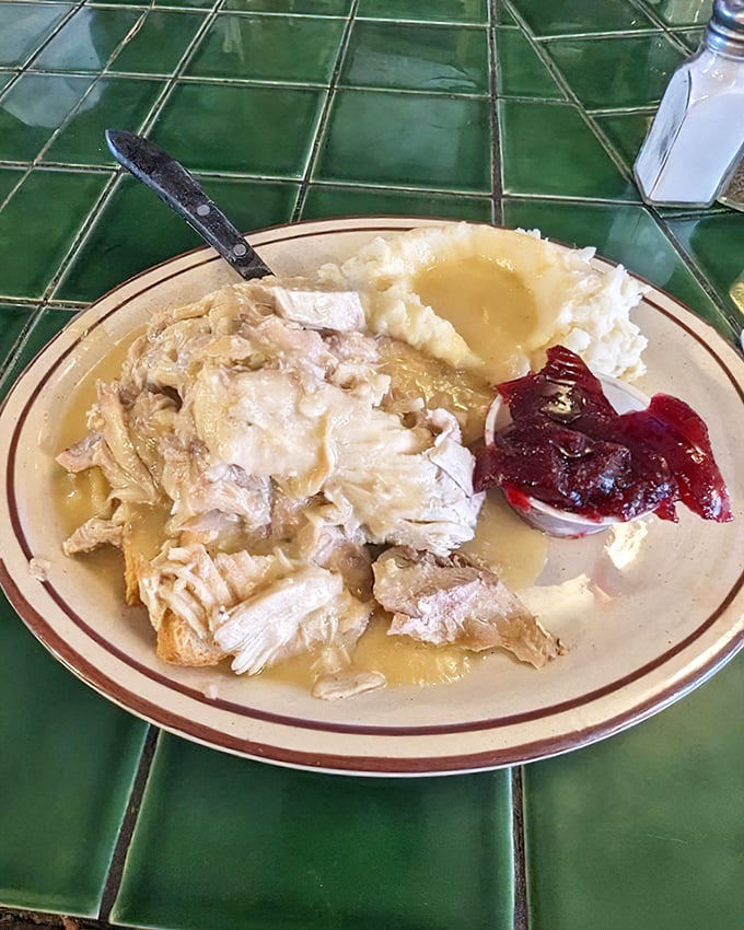 Open-face turkey with mashed potatoes and cranberry sauce—Thanksgiving doesn't have to wait for November when Teddy's has this on the menu.