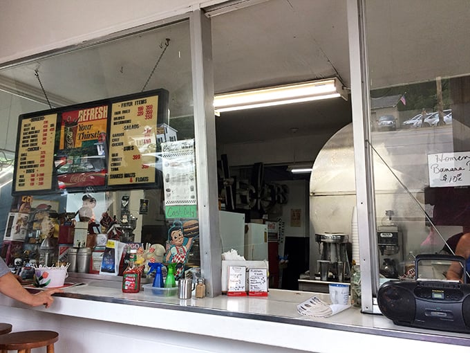 The ordering window—a portal to happiness where dreams of perfectly fried delights come true. Place your order and prepare for joy.