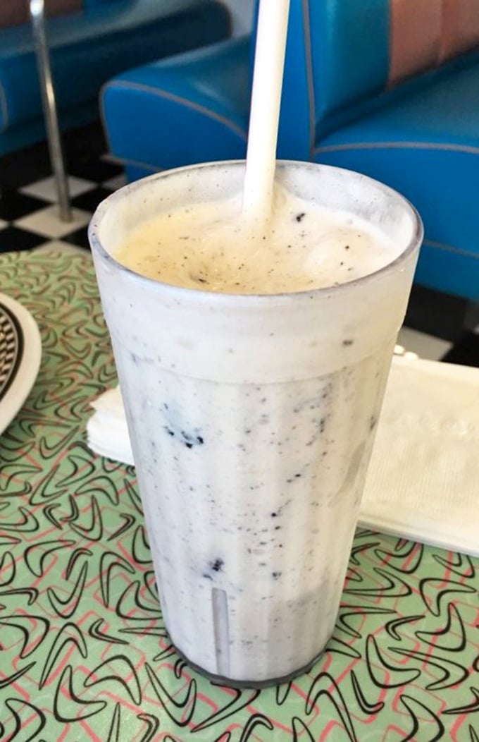 This Oreo milkshake isn't just a drink, it's a commitment to happiness—thick enough to require serious straw strength and worth every calorie.