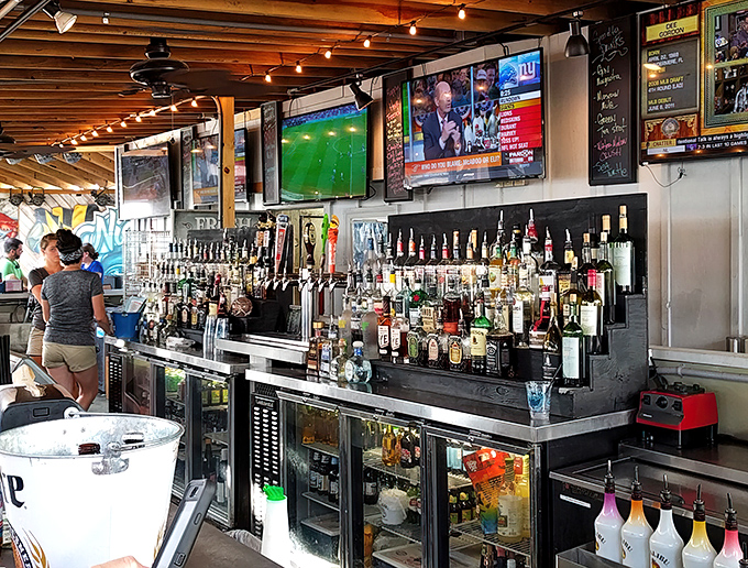 This isn't just a bar – it's command central for waterfront revelry, where bartenders orchestrate the perfect balance of libations and laughter.