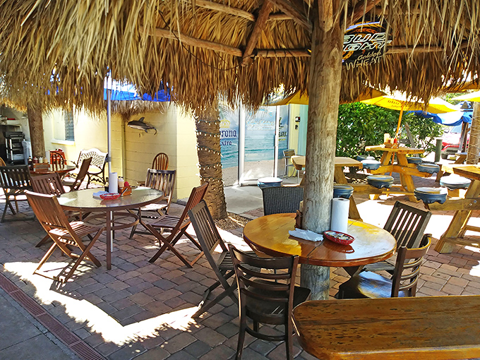 Outdoor seating that captures the essence of Florida dining—palm fronds overhead, salt air all around, and seafood that tastes like it jumped onto your plate.