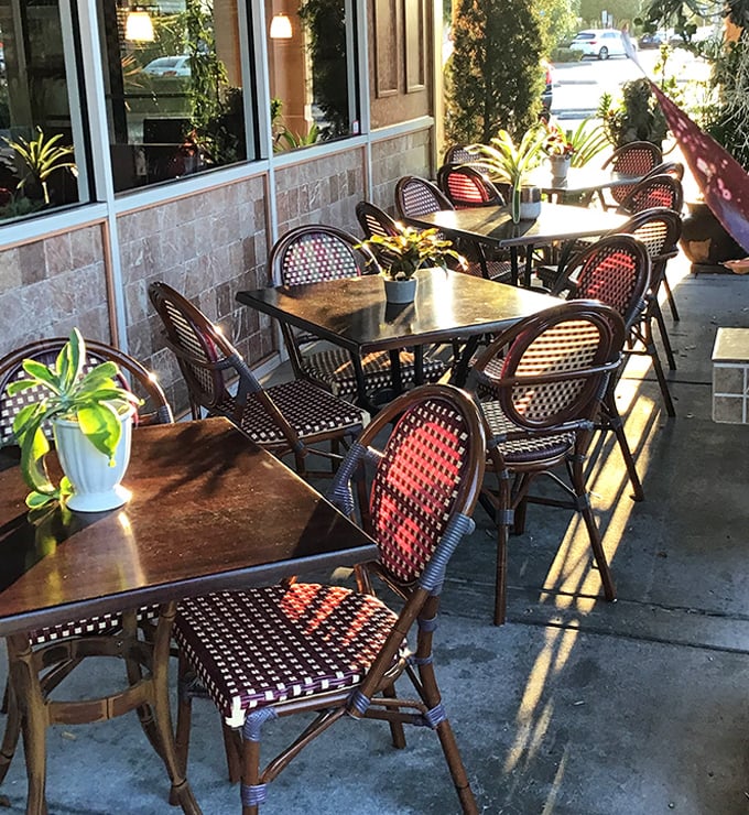 Florida dining done right—outdoor seating with bistro charm. Those woven chairs have "linger over coffee" written all over them.