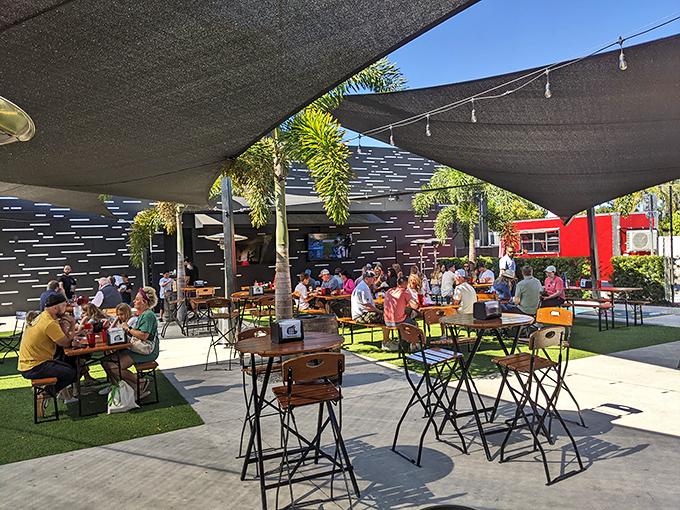 Florida outdoor dining done right—shaded, breezy, and surrounded by palms. Proof that paradise doesn't require a beach view.