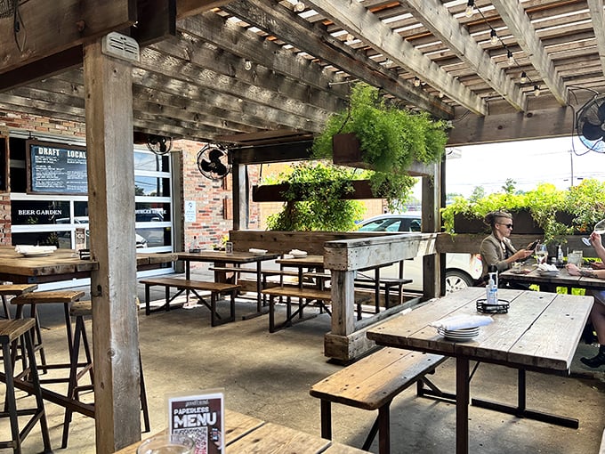 The outdoor patio—where Texas sunshine, cold beer, and wooden tables create the perfect trilogy for an afternoon escape from reality.