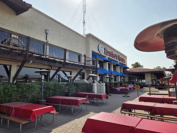 Outdoor seating with red tablecloths overlooking Phoenix—dining with a view that rivals any fancy steakhouse.