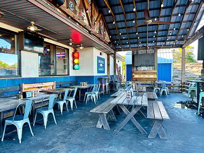 Outdoor picnic tables under string lights—because barbecue tastes 20% better with a Gulf breeze and the sound of vacation all around.