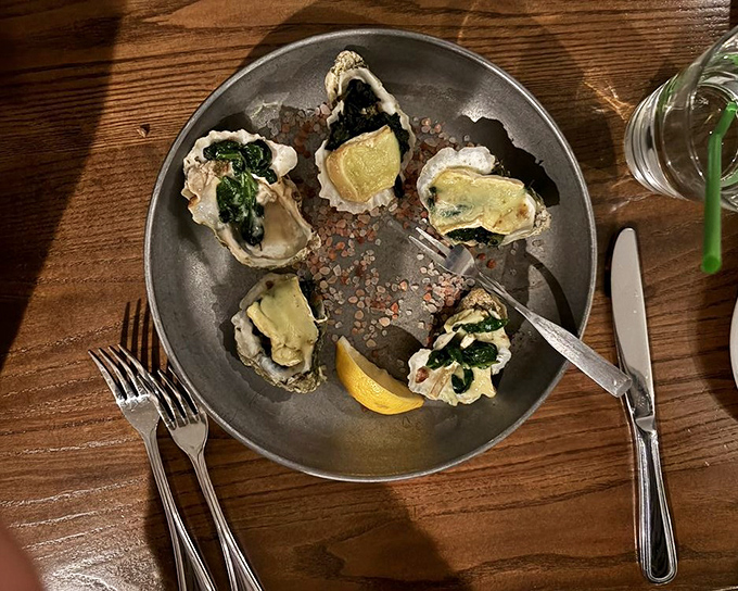 These aren't just oysters—they're little flavor bombs dressed in their Sunday best, ready for their close-up before their delicious demise.
