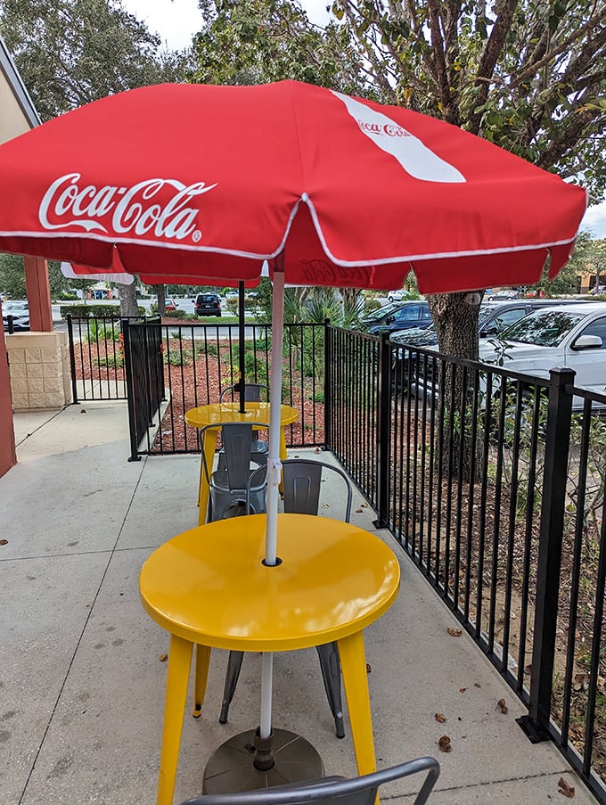 Even the patio seating comes with that classic Coca-Cola umbrella charm of authentic American dining.