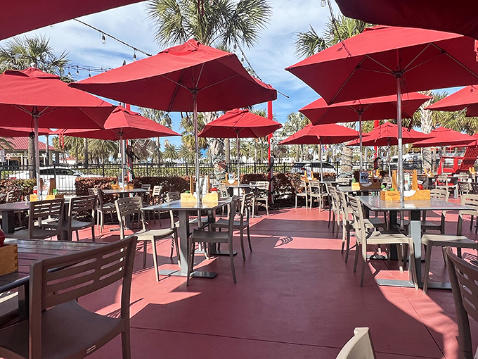 Red umbrellas create an outdoor oasis that says, "Yes, you can have another cocktail—you're on Florida time now."