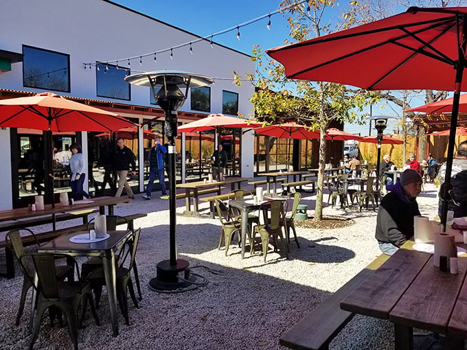 Al fresco dining under red umbrellas. Texas sunshine and burger perfection—some combinations are just meant to be.