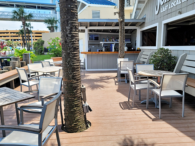 The outdoor deck – where salt air seasons every bite, palm trees provide natural shade, and the Gulf of Mexico serves as the ultimate dining backdrop.