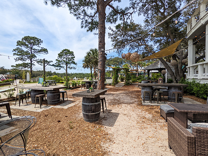 Nature's dining room. The rustic outdoor seating area with barrel tables invites you to savor seafood under Florida's impossibly blue skies.