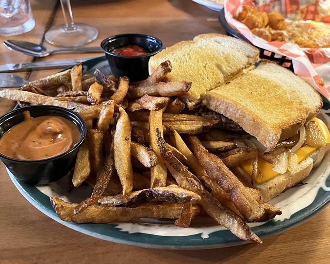 A proper patty melt should require both hands and several napkins. This golden-grilled beauty with its cascade of hand-cut fries doesn't disappoint on either count. 