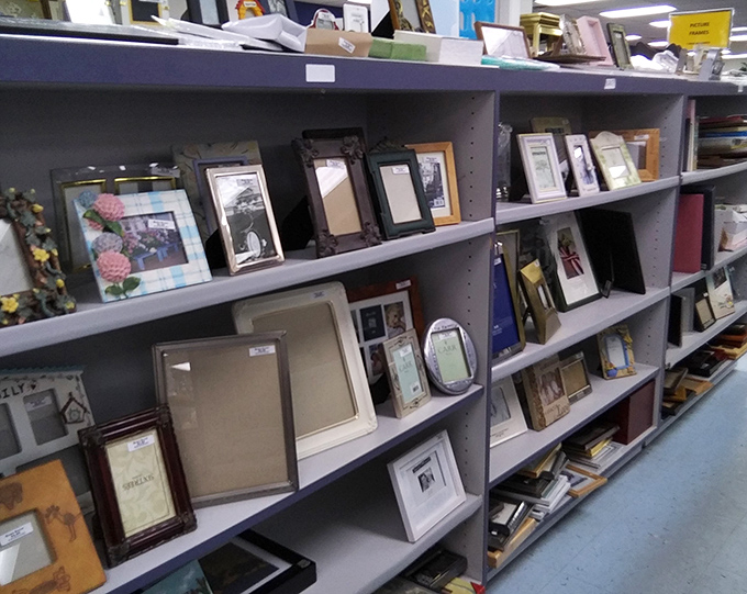 Picture frames of every shape and size stand at attention, each one eager to embrace your family photos in vintage style. 
