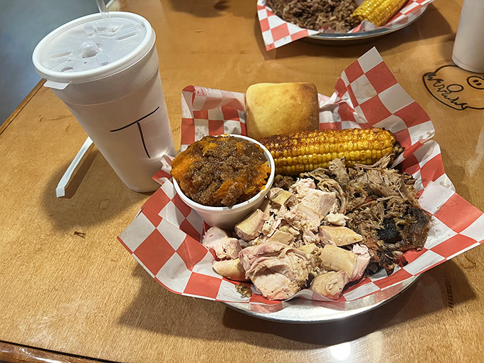 The sampler that solves family feuds—chicken, pulled pork, sweet corn, and that sweet potato side that steals the show.