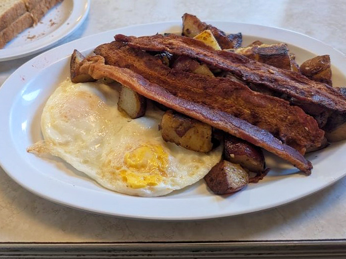 Eggs, bacon, and potatoes—the holy trinity of breakfast, executed with the reverence it deserves.