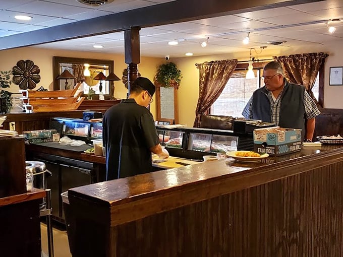 The preparation area reveals the restaurant's commitment to freshness – where seafood meets its destiny at the hands of trained professionals.