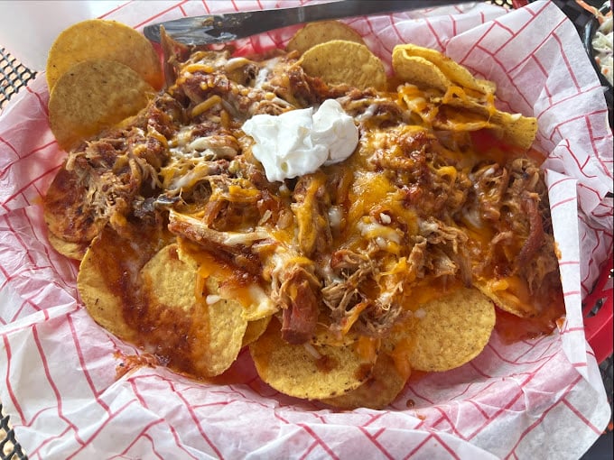 Pulled pork nachos: where Tex meets Mex in a beautiful collision that renders silverware completely unnecessary.