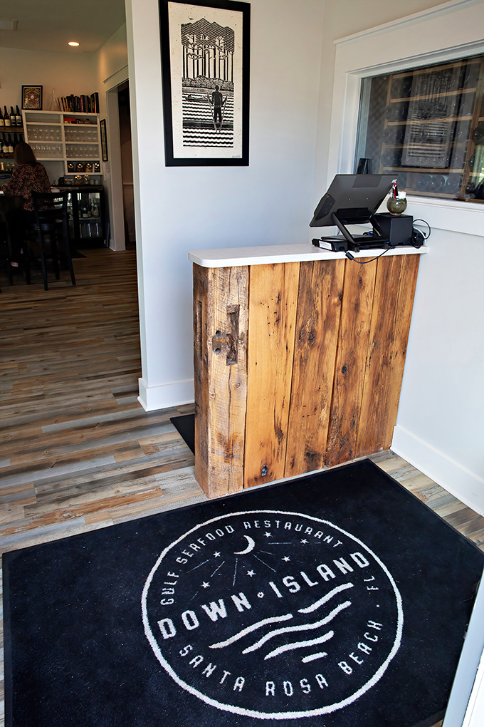 The Down Island logo greets you underfoot—a promise that you're about to step into seafood territory worth exploring.