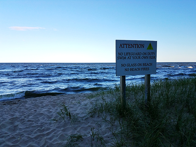 The sign says "swim at your own risk," but the real danger is falling so deeply in love with this beach you'll never want to leave.
