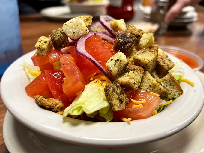 A salad that doesn't apologize for being a salad. Those homemade croutons aren't just garnish – they're the supporting cast.
