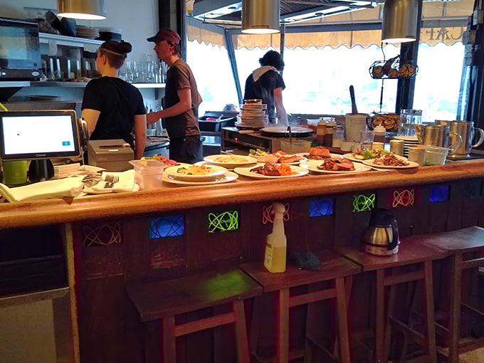 Where culinary magic happens before reaching your table. Those plates waiting in line look like they're auditioning for their big moment.