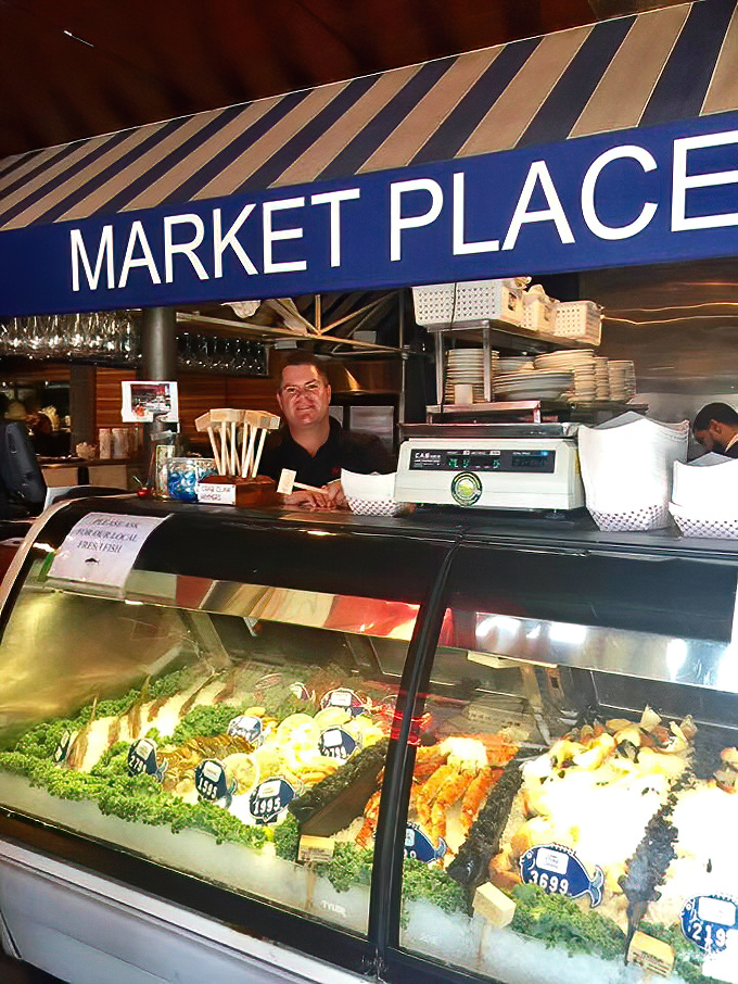 The Market Place seafood counter – where tomorrow's dinner waits on ice. Like a jewelry store, but the gems are edible and taste like the ocean.