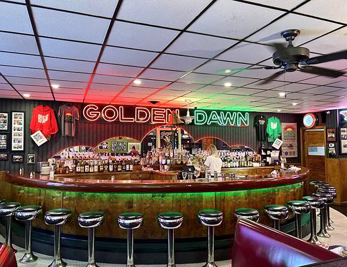 The circular bar creates a community—where strangers become friends and regulars are treated like royalty under the glow of red and green neon.