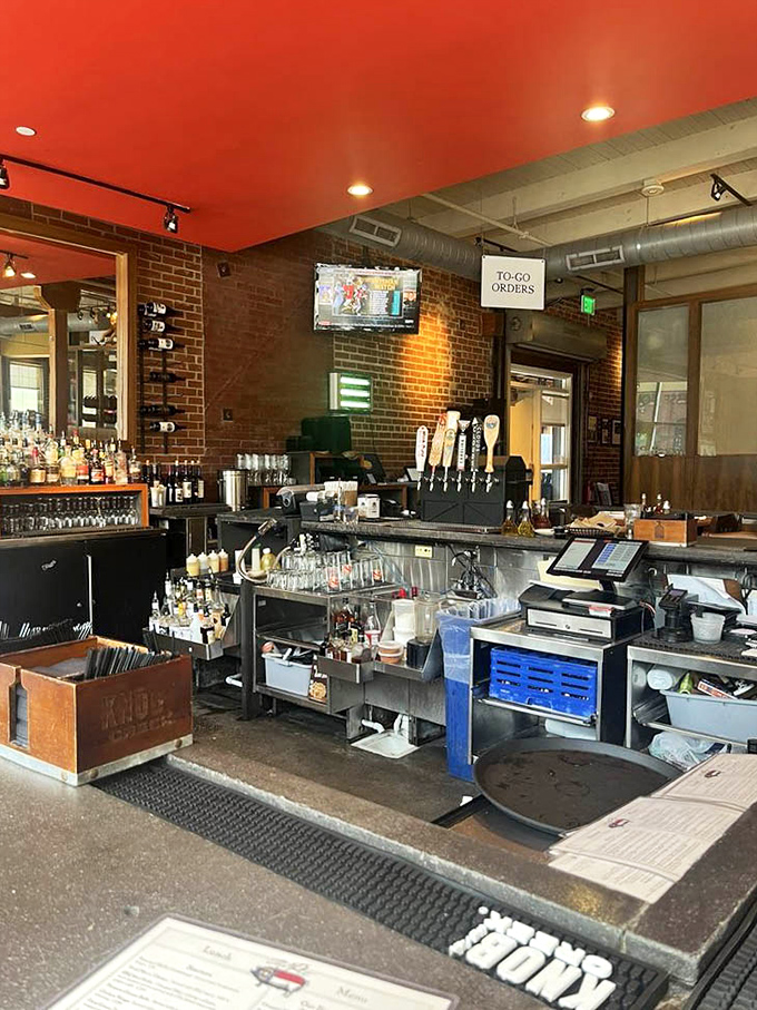 The bar area stands ready for those wise enough to enjoy a local brew while waiting for their barbecue—patience tastes better with a pint.