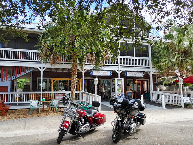 Motorcycles parked outside a two-story gallery with wraparound porches – even road warriors know when to stop and appreciate Micanopy's laid-back charm.