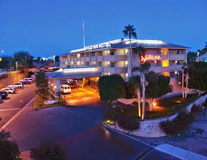 The Shilo Inn glows invitingly at dusk, perfect for visiting friends who claim they want to see you but really just need to escape winter.