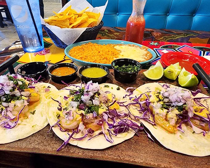 These shrimp tacos aren't merely assembled—they're composed, with purple cabbage adding dramatic contrast against tender shrimp and soft tortillas.