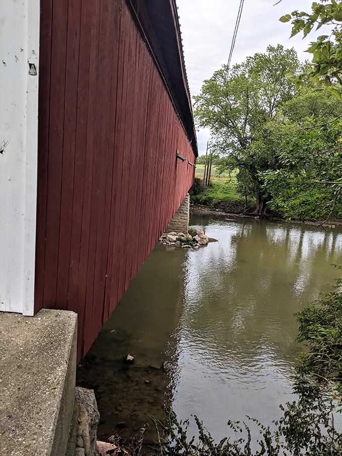 The weathered red siding tells stories of countless rainstorms, snowfalls, and summer heat waves—if only these boards could talk.