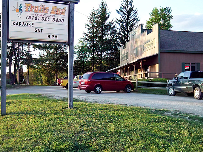 The roadside sign promises karaoke on Saturday nights—because nothing pairs with prime rib like belting out "Sweet Caroline" with strangers.