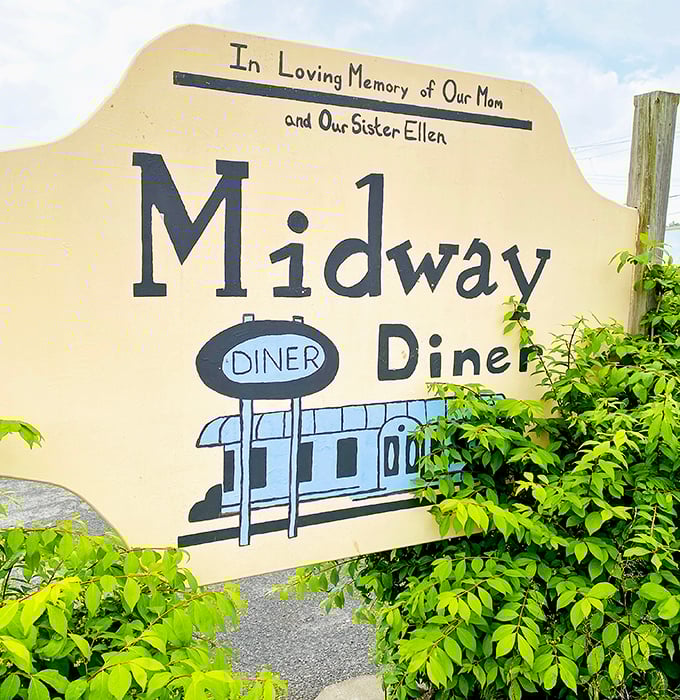 "In Loving Memory of Our Mom and Our Sister Ellen"—this sign reveals the heart behind Midway Diner, where family legacy is baked into every recipe.