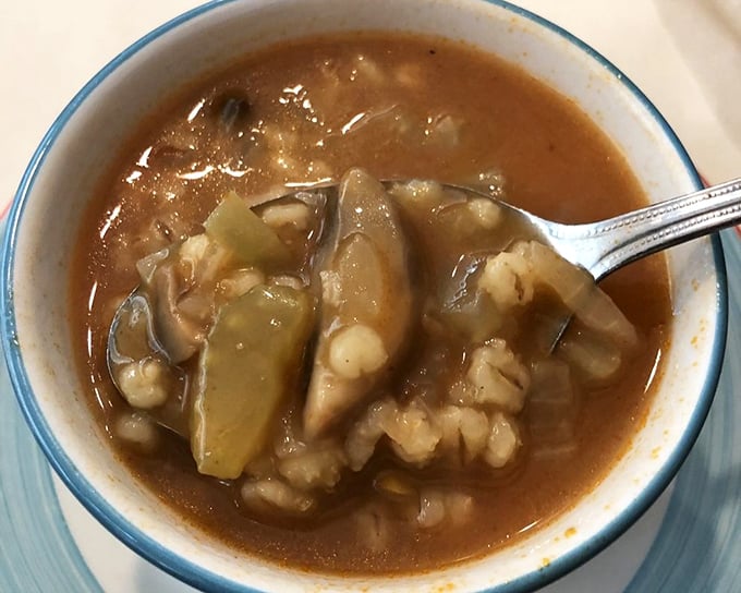 A soup that whispers "homemade" with every spoonful—vegetables and barley swimming in broth that clearly simmered all day.