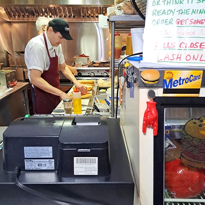 Sandwich artisans at work. These aren't just cooks—they're craftspeople creating edible masterpieces one order at a time.