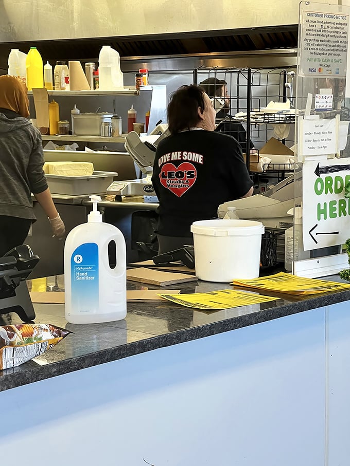 Behind the counter, where sandwich dreams become reality. "Give Me Some Leo's Steaks" isn't just a shirt – it's a philosophy of life.